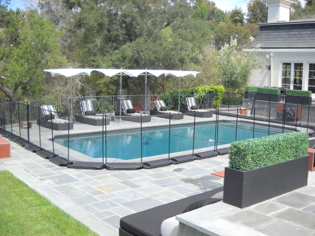 Pool Safety Fences: Glass, Iron, & Aluminum Fences